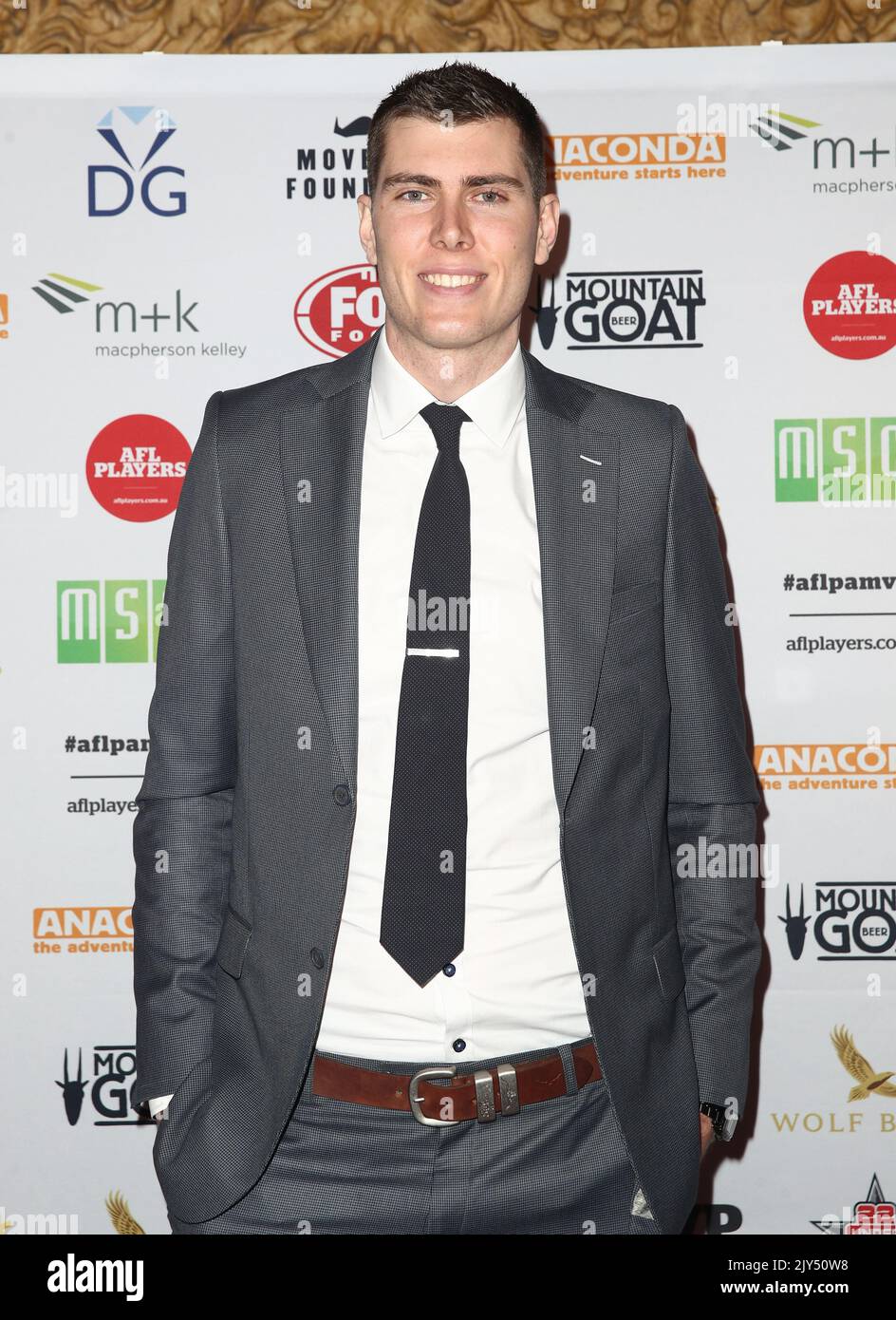 Mason Cox of the Magpies poses for a photograph on the red carpet at ...