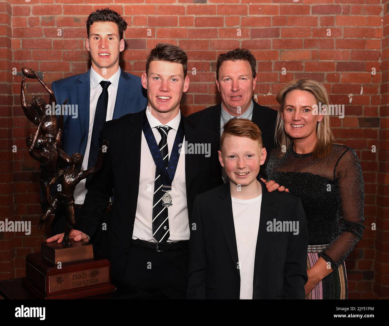 Sam Walsh of the Carlton Blues (second from left) poses for a ...