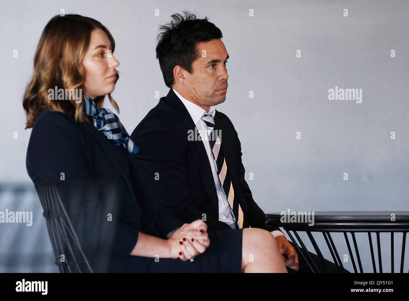 Former Geelong player Matthew Stokes listens during a memorial service ...