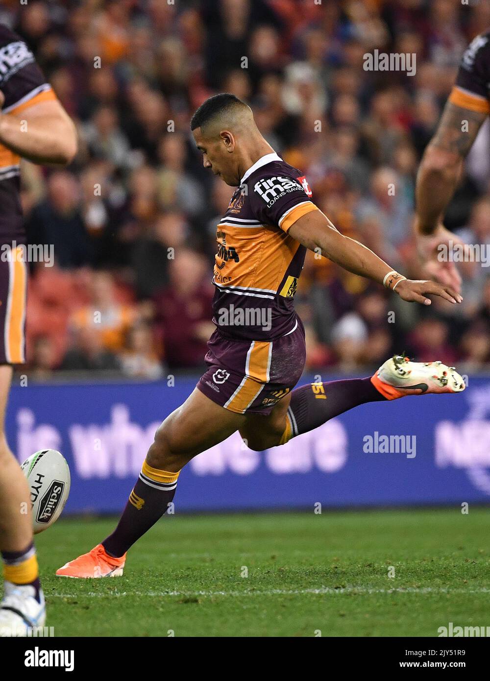Jamayne Isaako of the Broncos kicks a drop goal in extra time to win ...