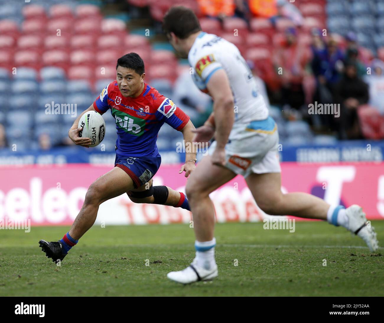 Mason Lino of the Knights in the clear after taking an intercept during ...