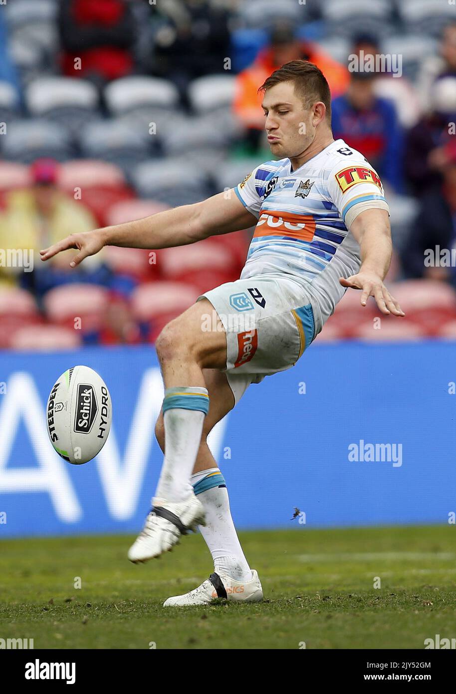 Ryley Jacks of the Titans puts in a kick during the Round 24 NRL match ...
