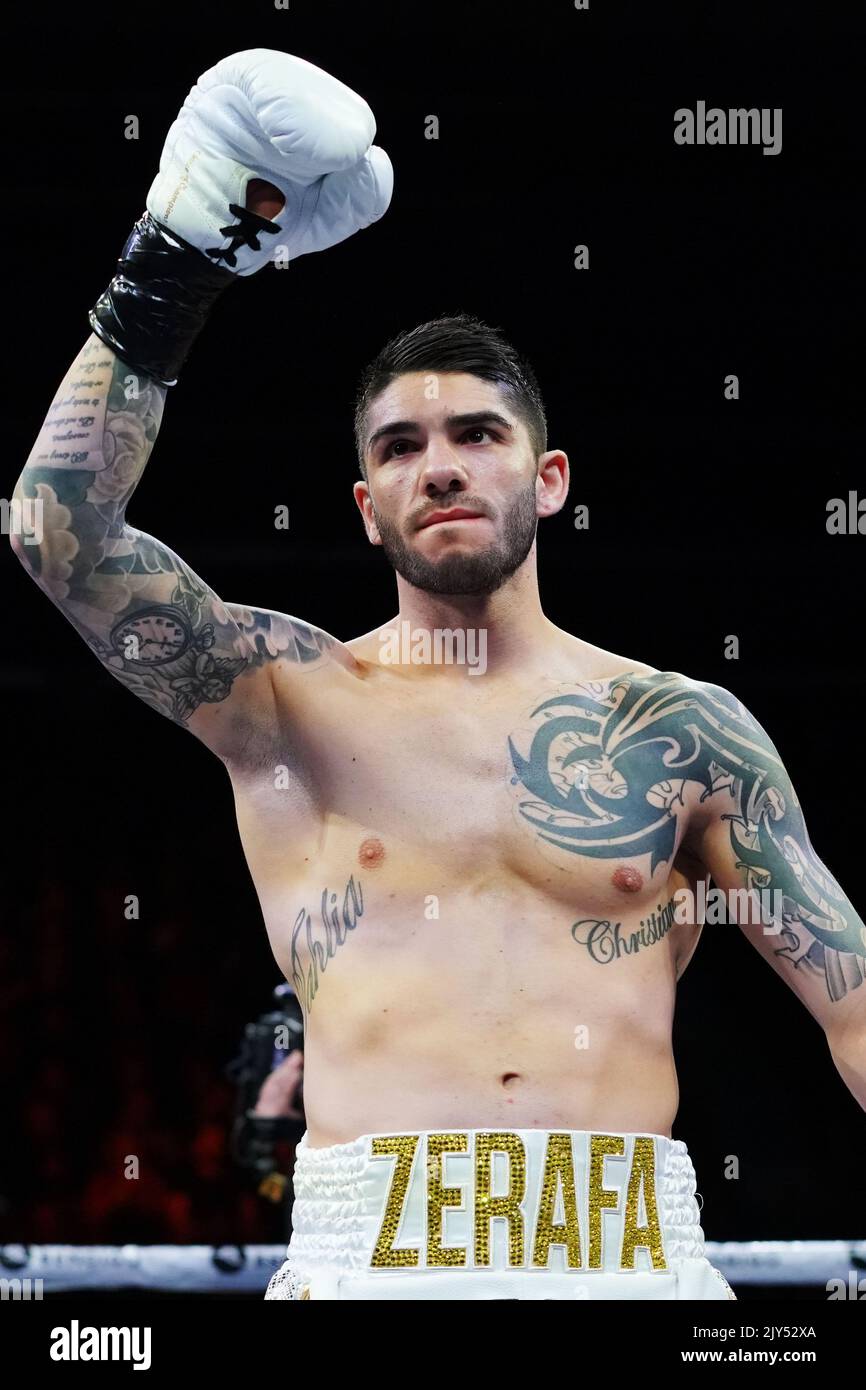 Australian boxer Michael Zerafa raises his arms against Jeff Horn ...