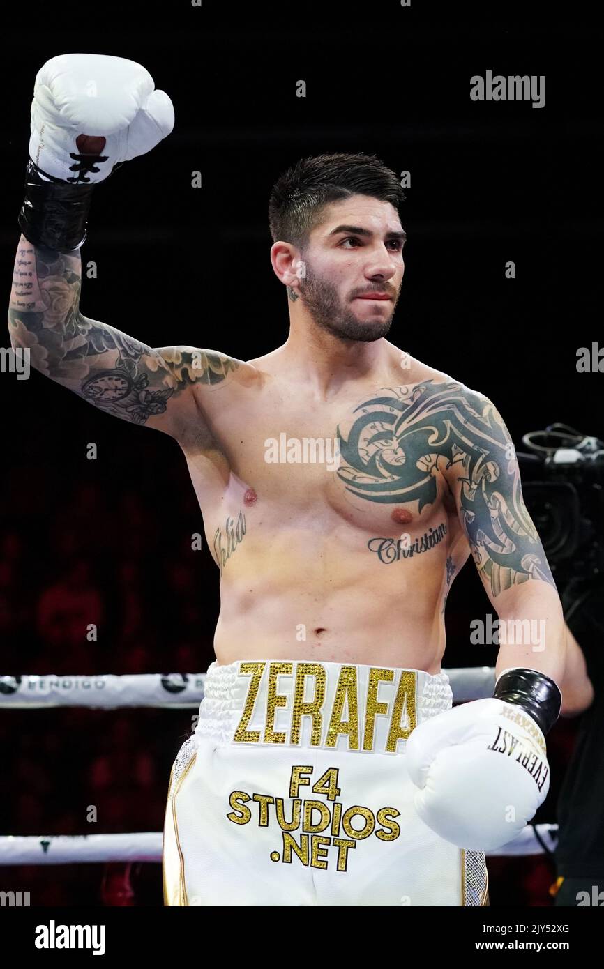 Australian boxer Michael Zerafa raises his arms against Jeff Horn ...