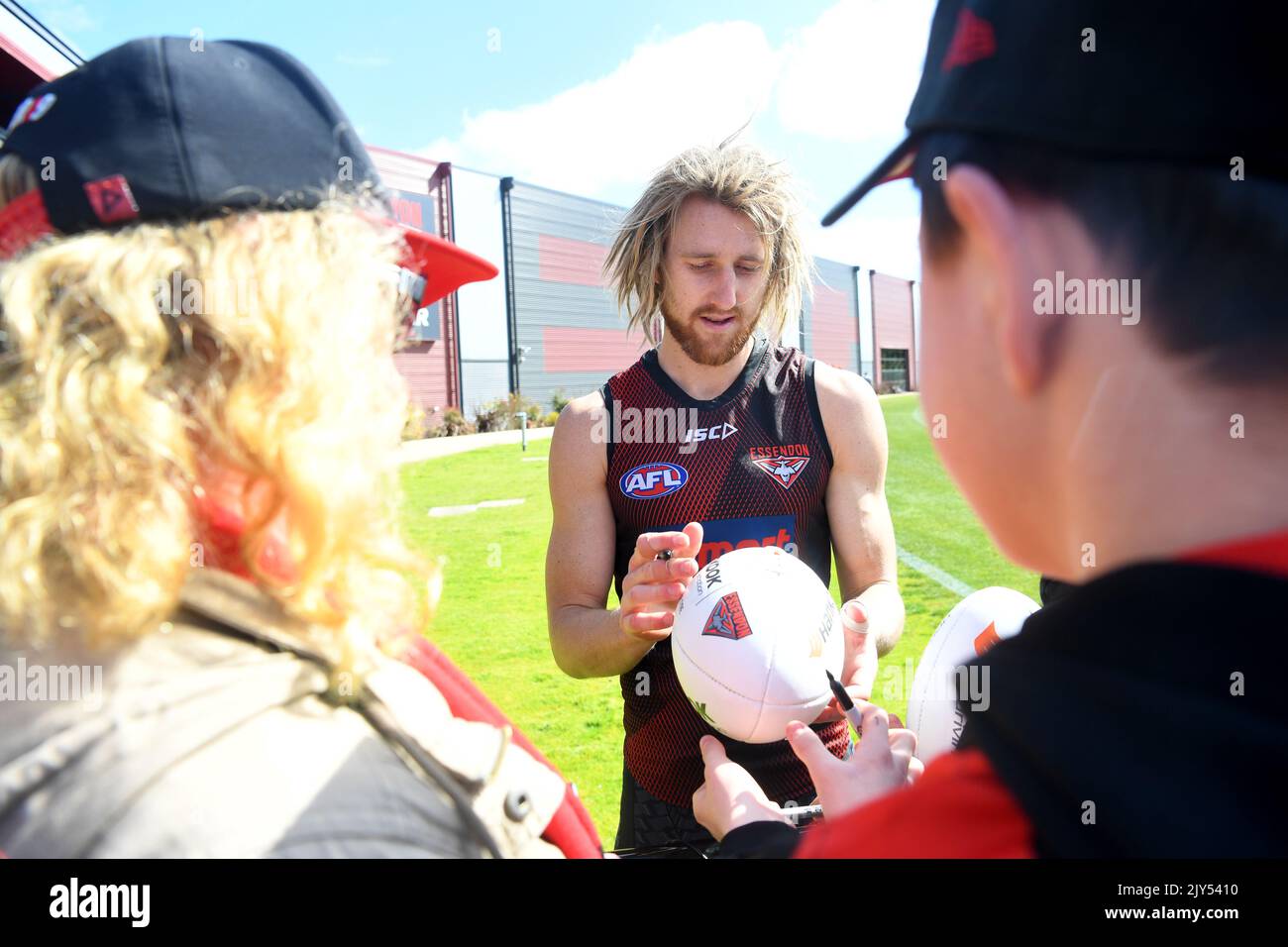 Dyson Heppel (centre) signs an autograph for a fan at the conclusion of ...