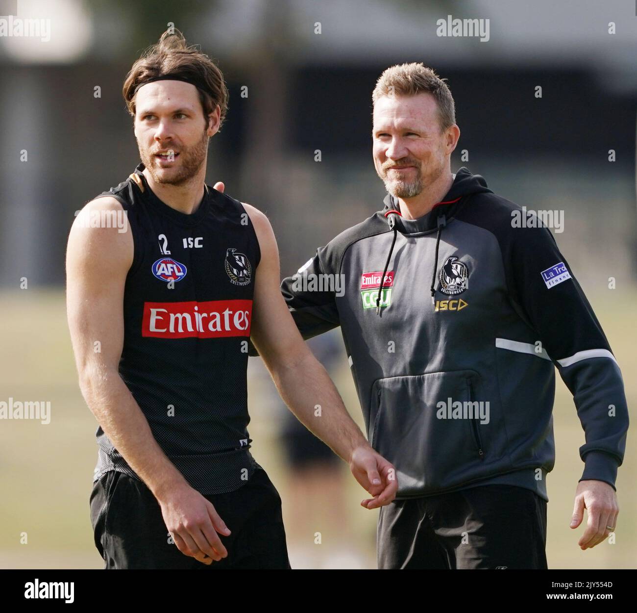 Magpies head coach Nathan Buckley hugs Matthew Scharenberg during a ...