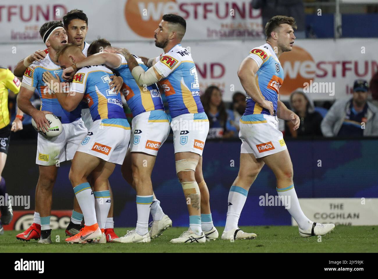 Mitch Rein (left) of Titans after scoring a try during the Round 25 NRL ...