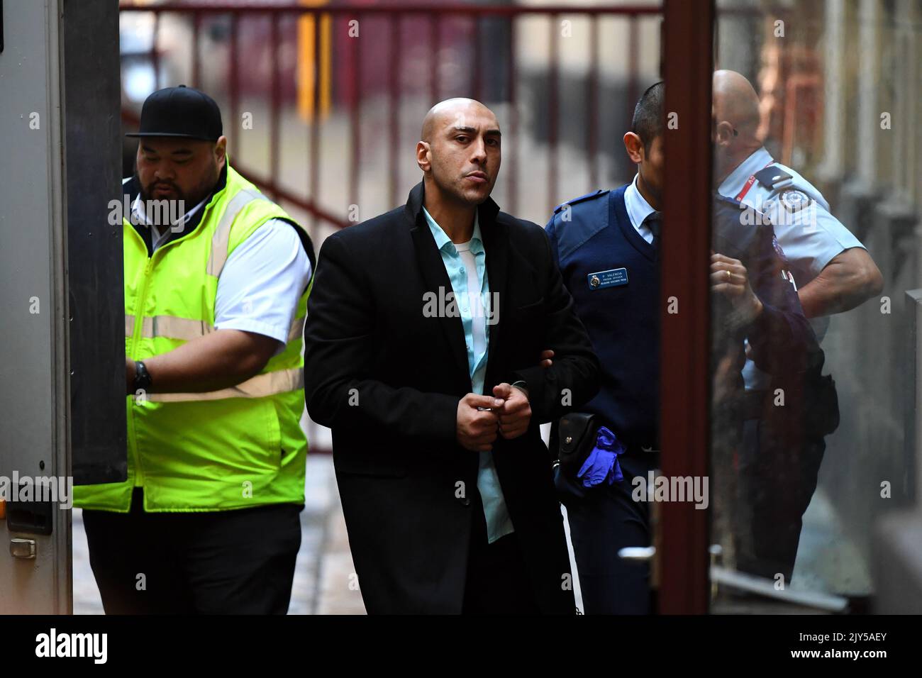 Albert Awad (centre) arrives to the Supreme Court of Victoria ...