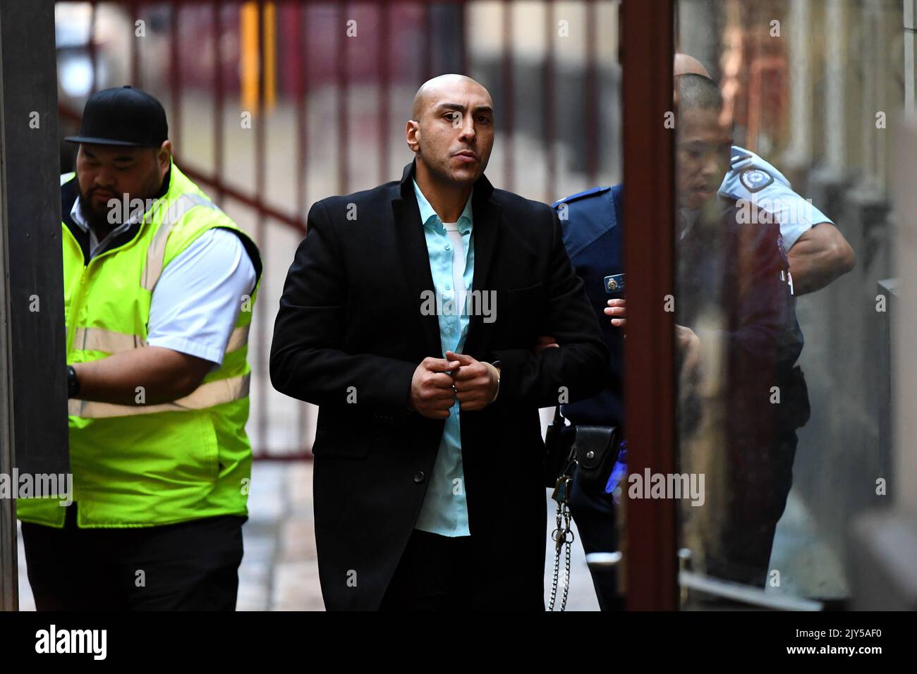 Albert Awad (centre) arrives to the Supreme Court of Victoria ...