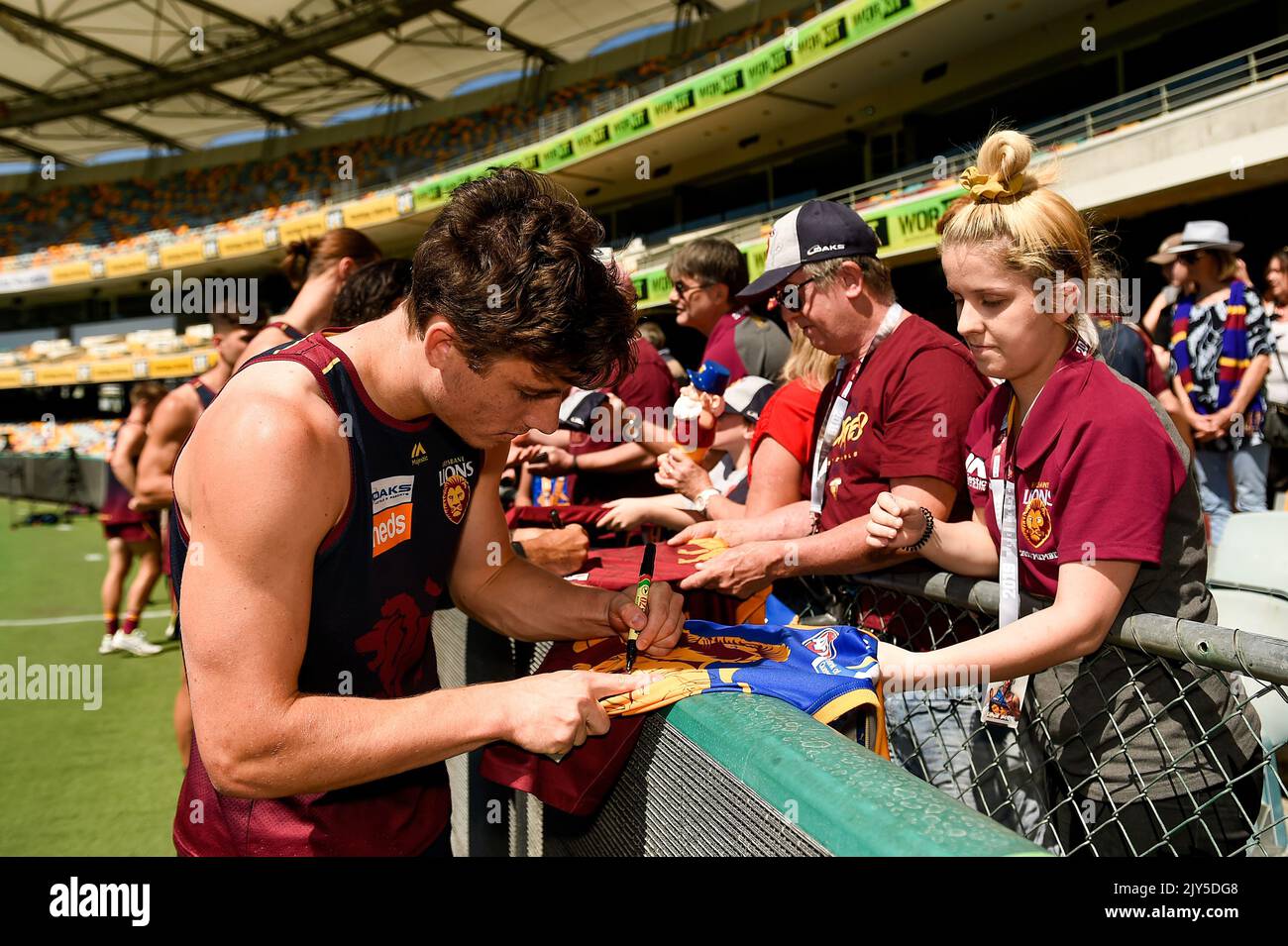 Noah Answerth signs autographs during a Brisbane Lions training session ...