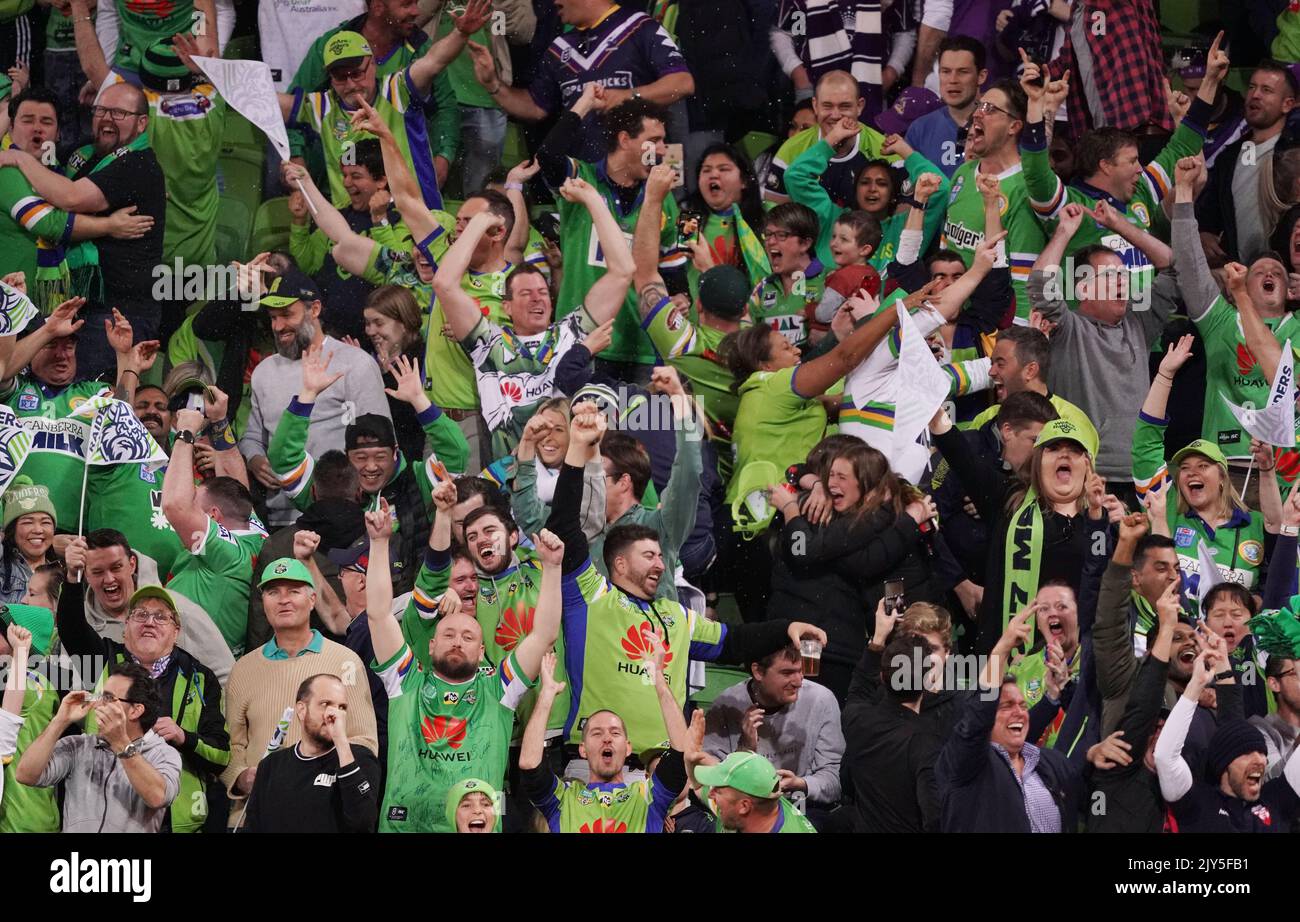Raiders fans in the crowd celebrate after winning the NRL Second ...