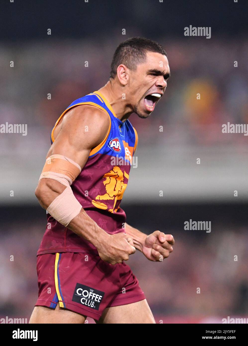 Charlie Cameron of the Lions celebrates kicking a goal during the ...