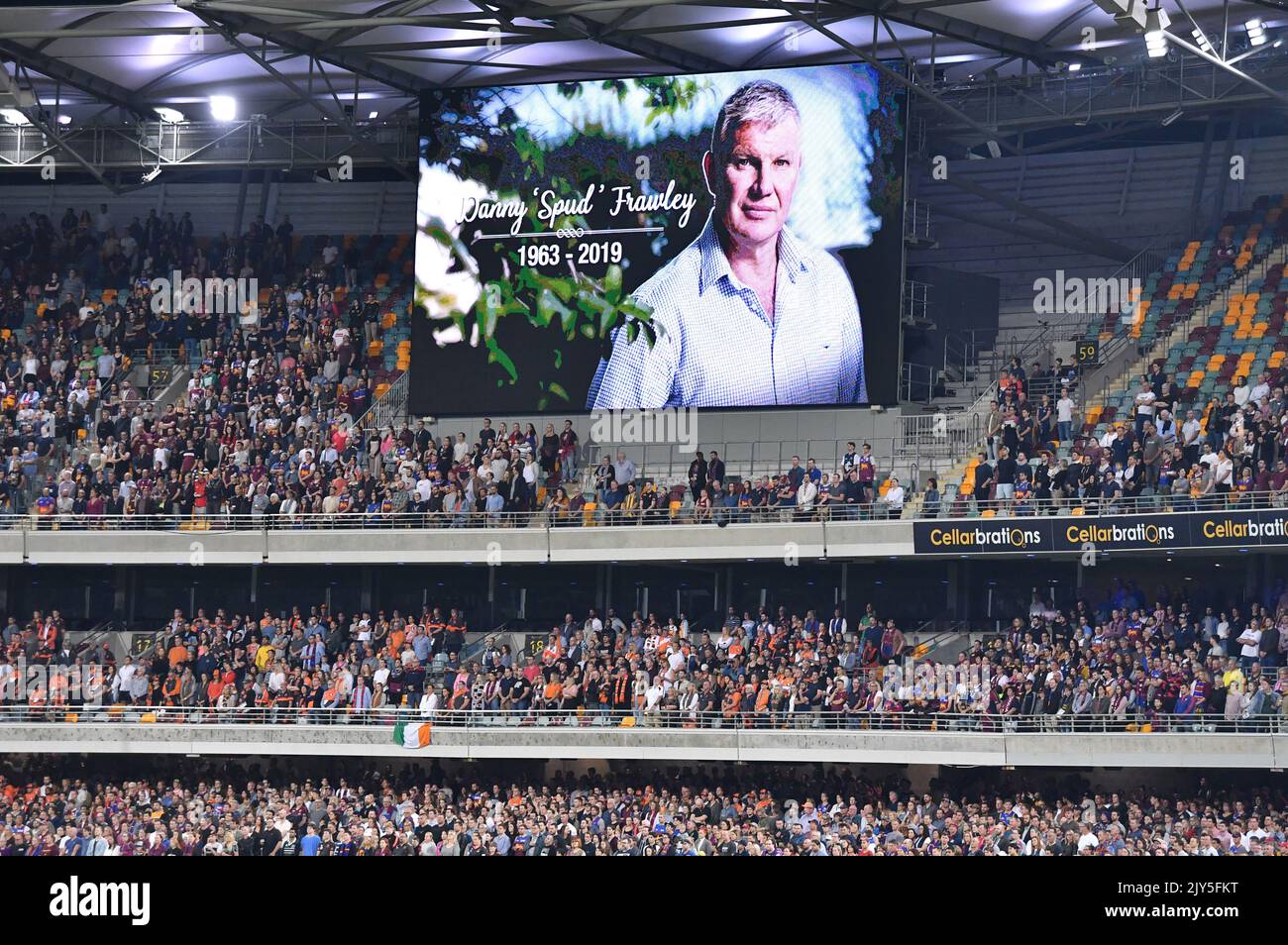 The crowd are seen standing for a moments silence to honour the life of ...
