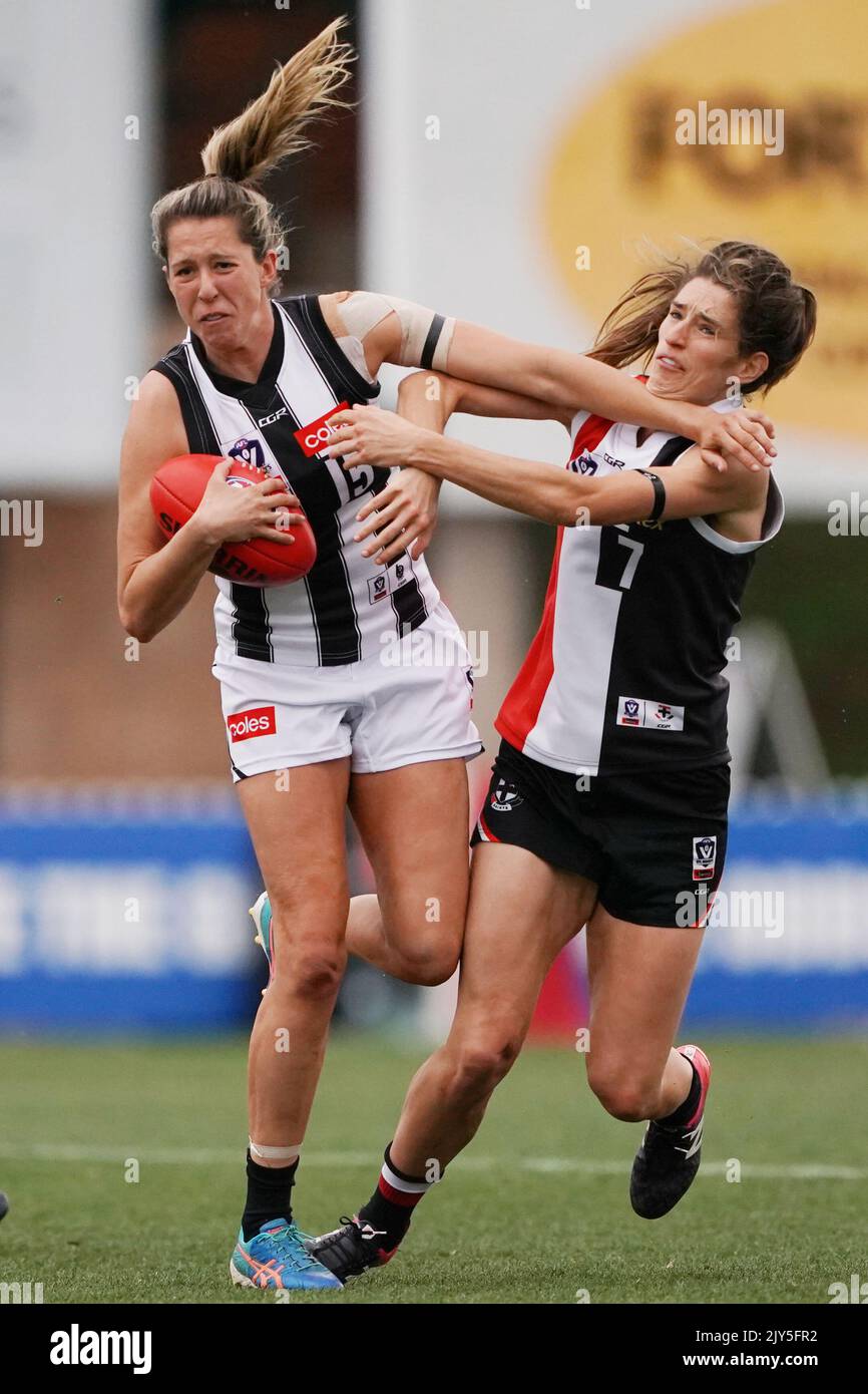 Catherine Phillips of the Saints is pushes away by Erica Fowler of the ...