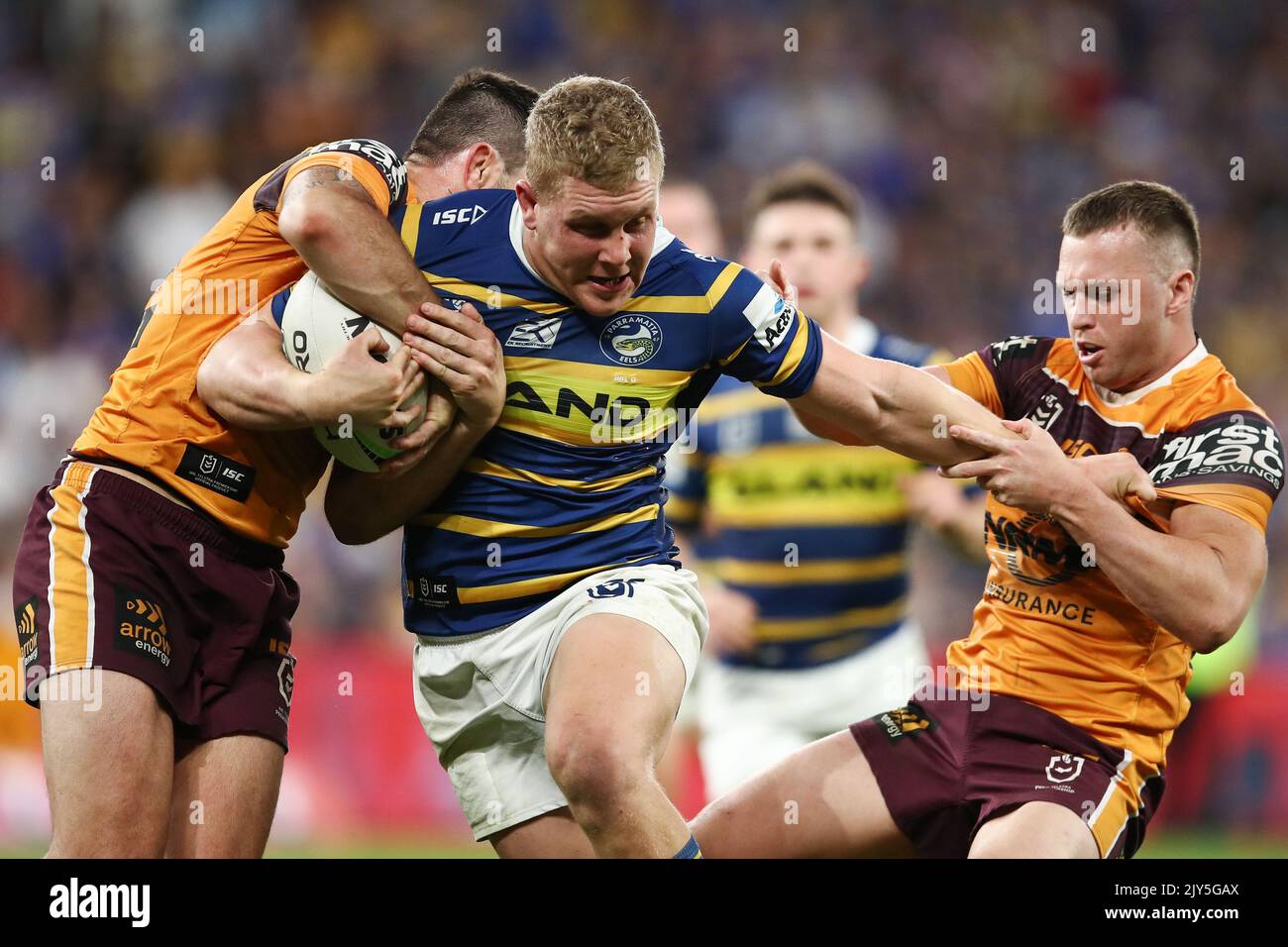 Daniel Alvaro of the Eels is tackled by the Broncos defence during the ...