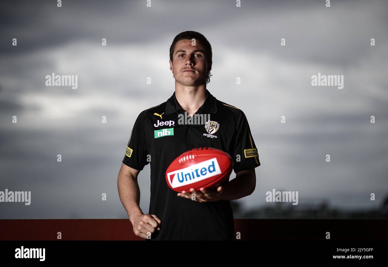 Liam Baker poses for a portrait during a Richmond Tigers AFL media and ...