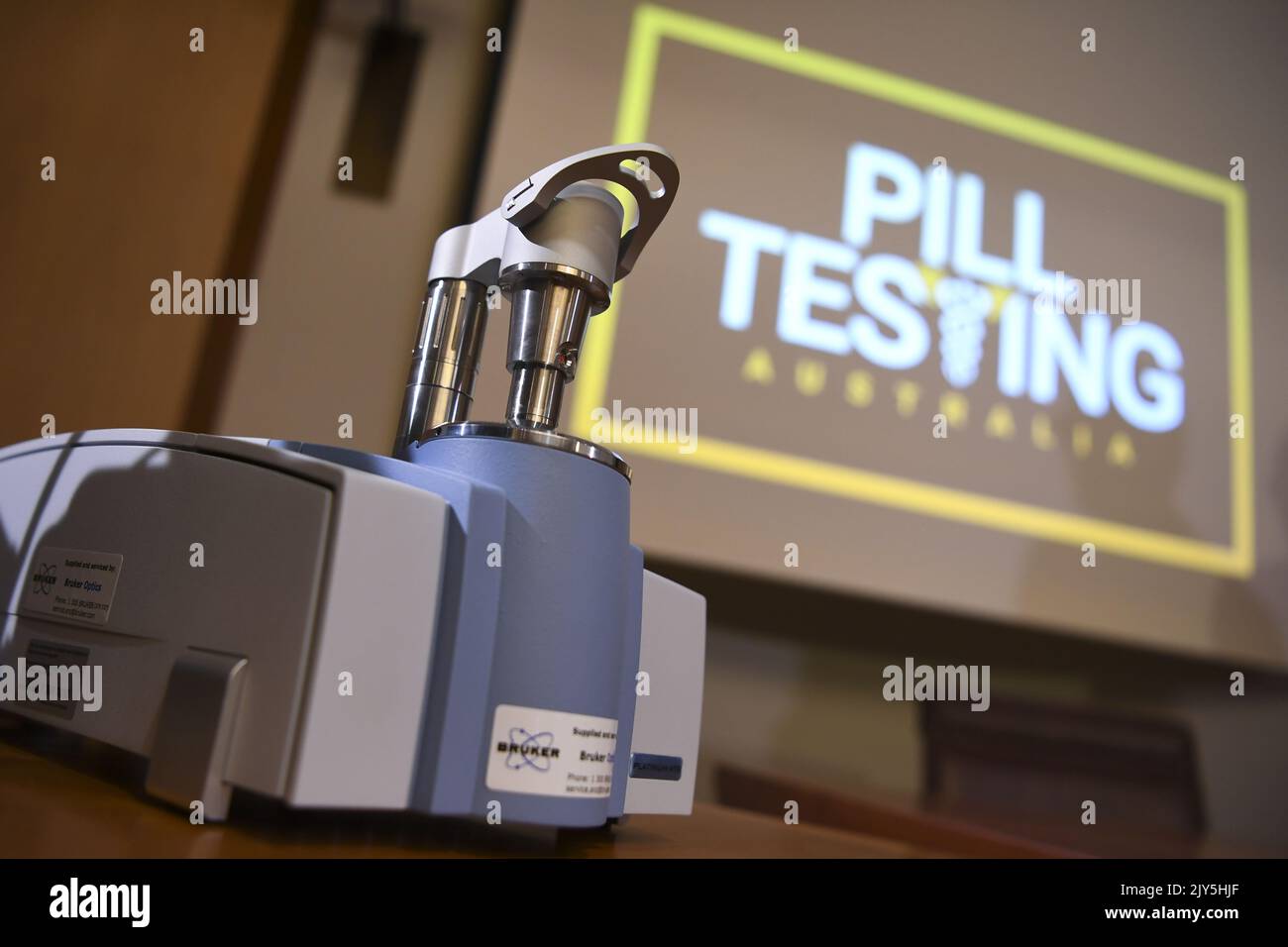 A Compact FTIR Spectrometer pill testing machine is seen during a ...