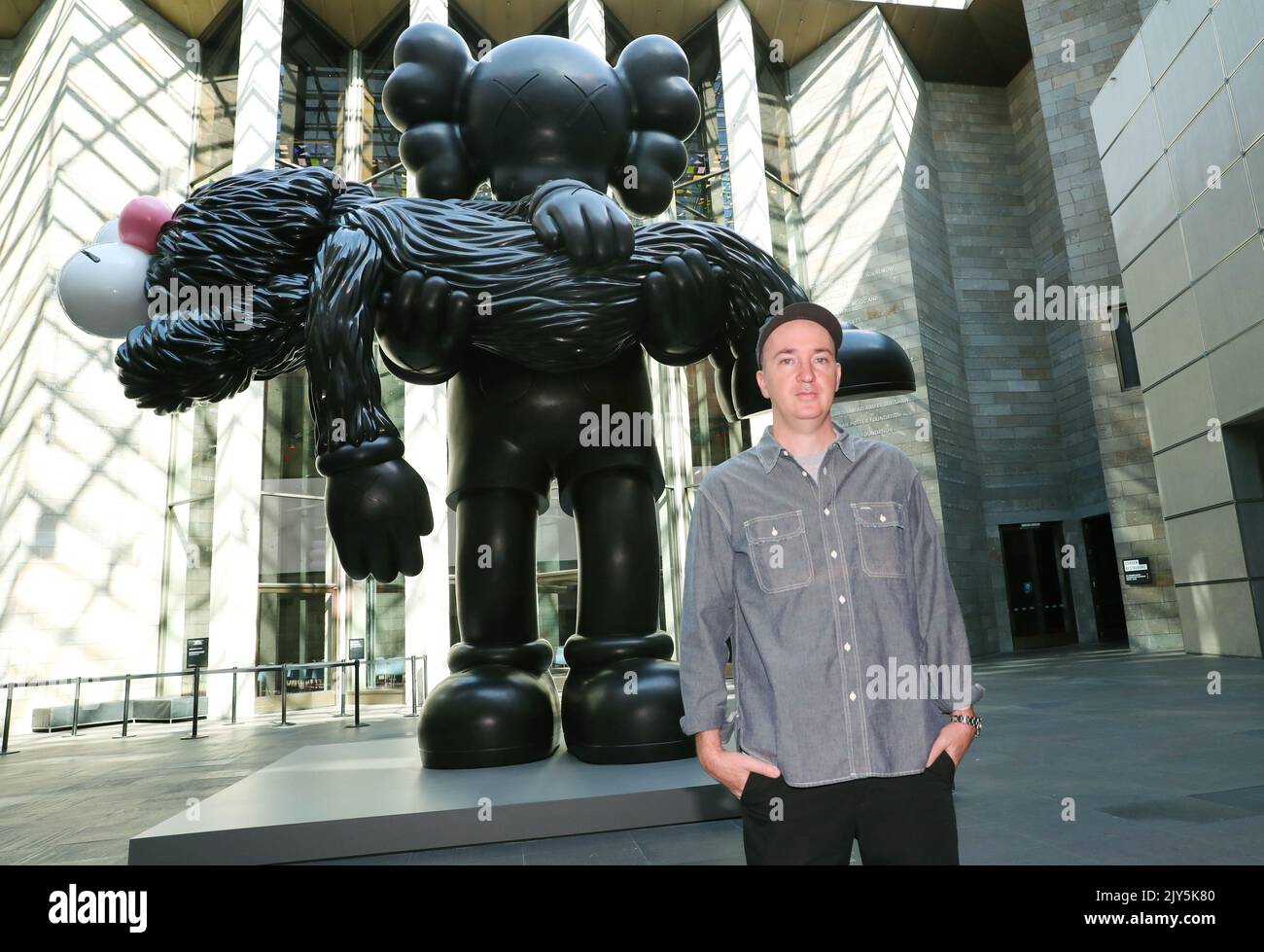 American artist Brian Donnelly, also known as KAWS, poses for a ...