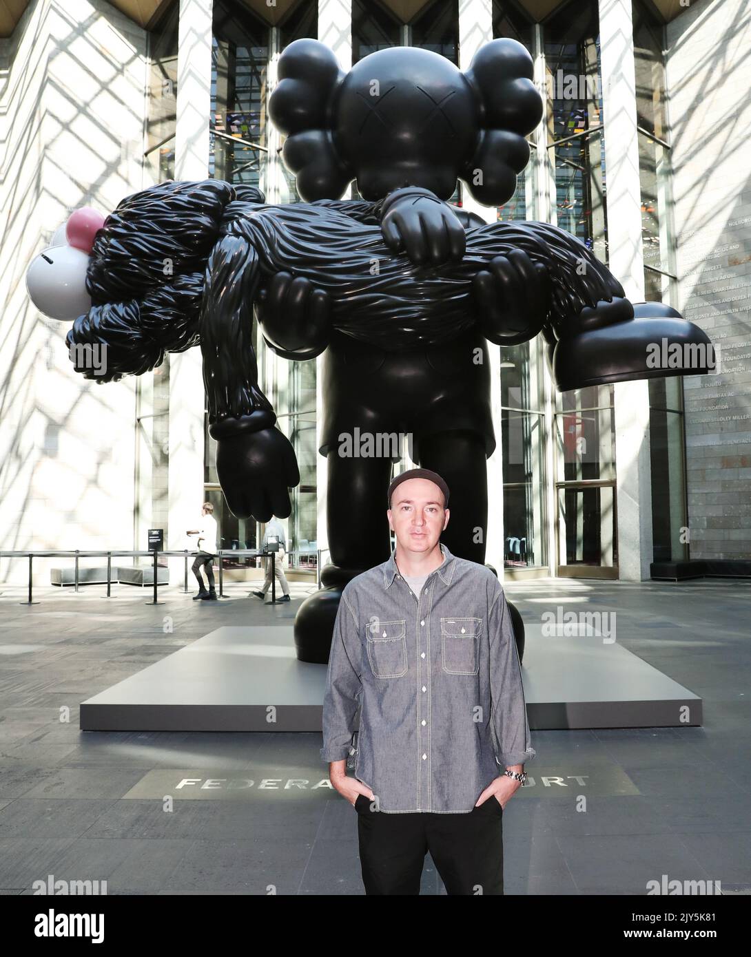 American artist Brian Donnelly, also known as KAWS, poses for a ...