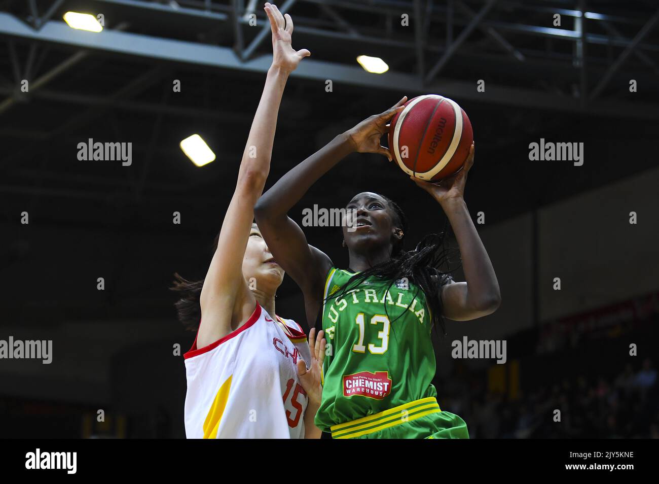 Ezi Magbegor of the Opals (right) fights for the ball with Han Xu of ...
