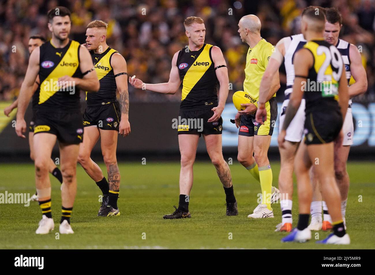 Josh Caddy of the Tigers talks to the umpire at half time during the ...