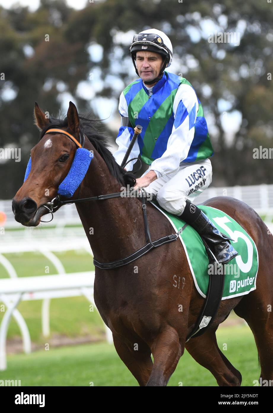 Jockey Dwayne Dunn returns to scale after riding Garner to victory in ...