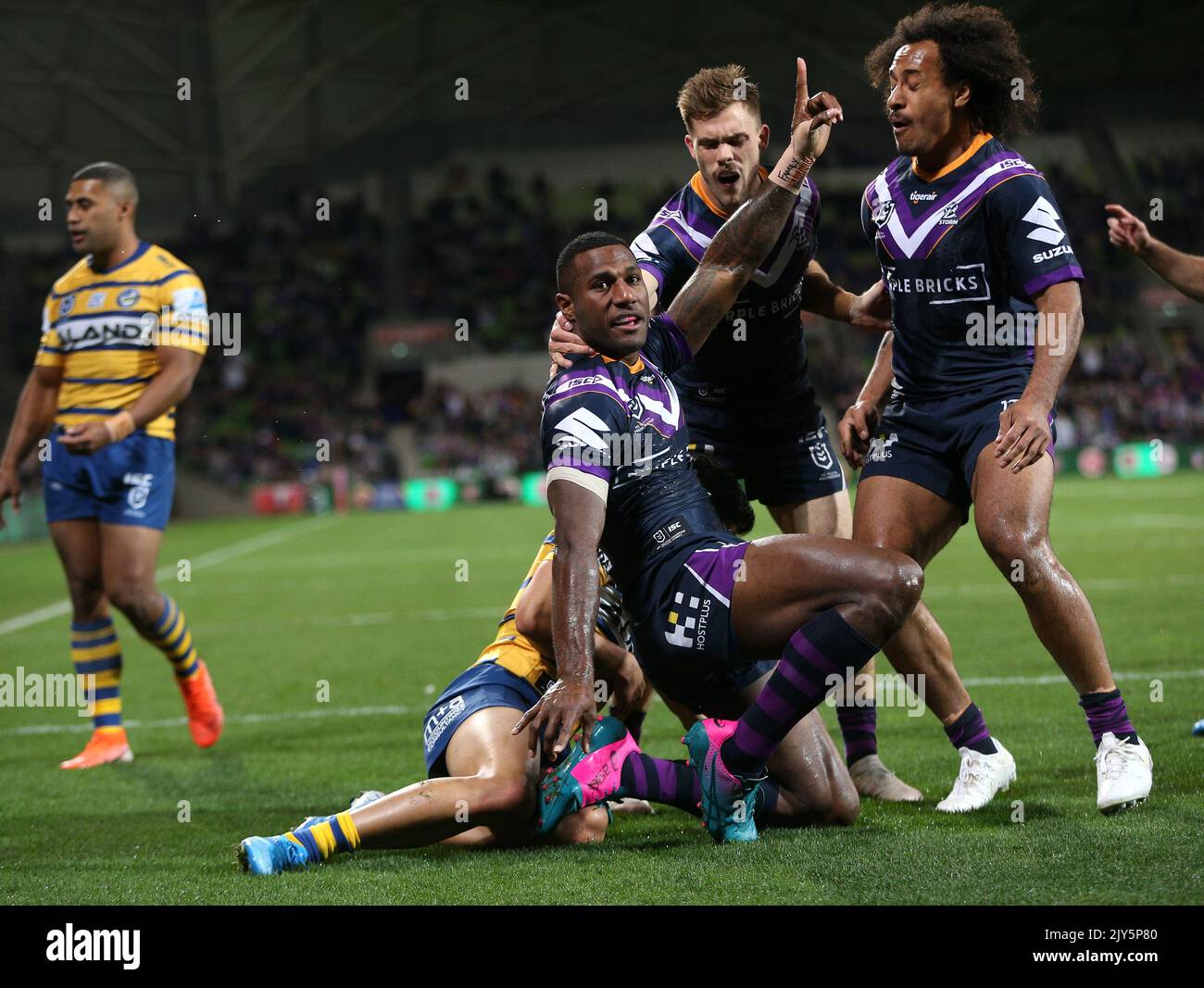 Suliasi Vunivalu of the Storm celebrates after scoring a try during the ...