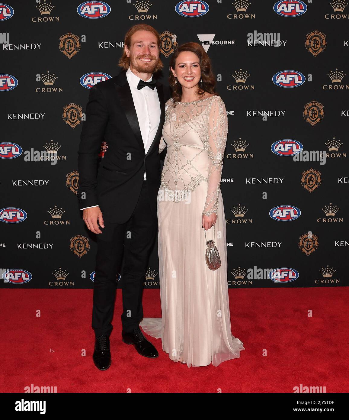 Tom Stewart of the Geelong Cats and his partner Emma Richards arrive at ...