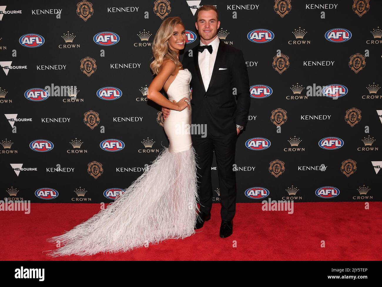 Tom Mitchell of the Hawthorn Hawks and his partner Hannah Davis arrive ...