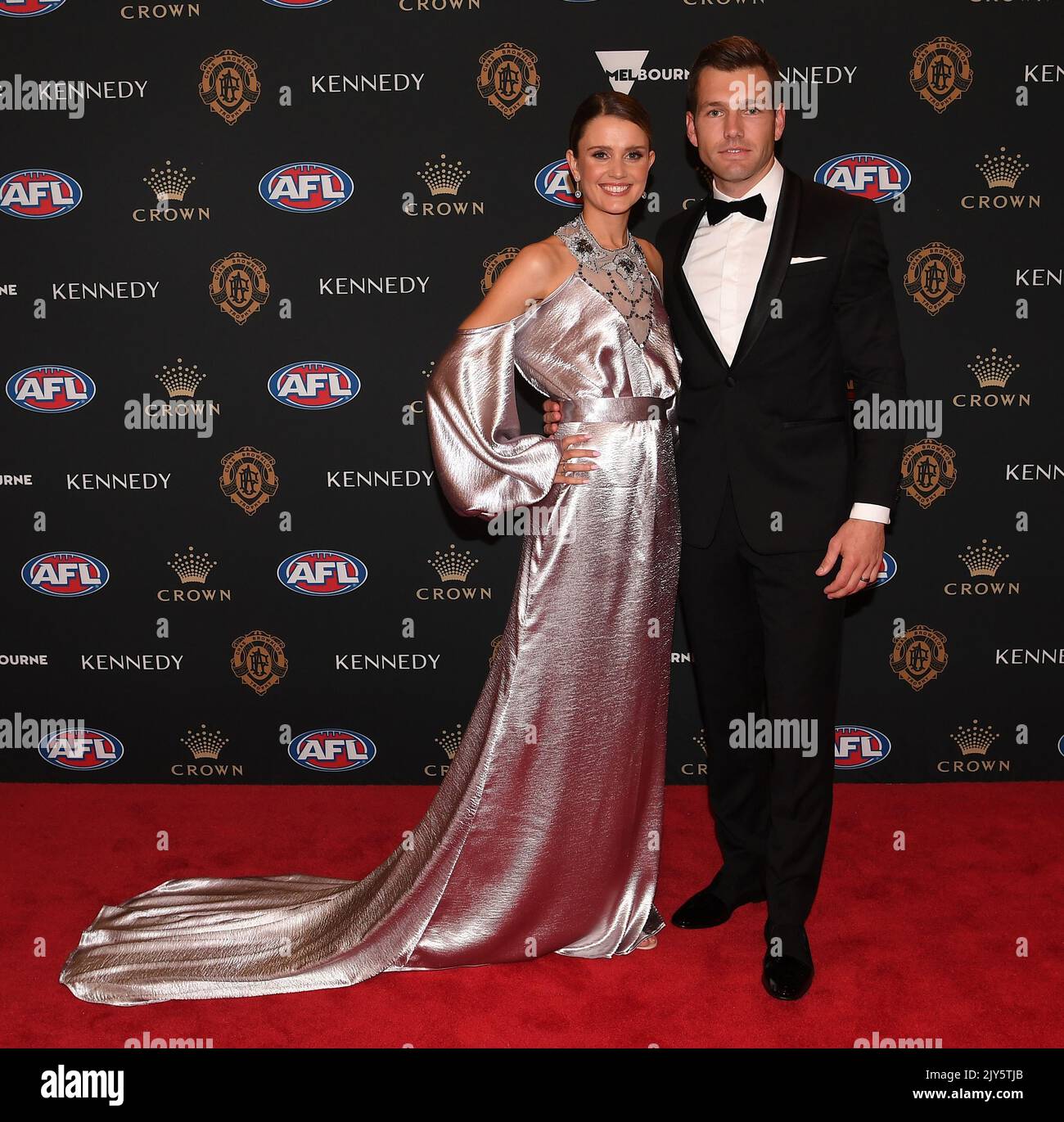 Shaun Higgins of the North Melbourne Kangaroos and his wife Heidi ...