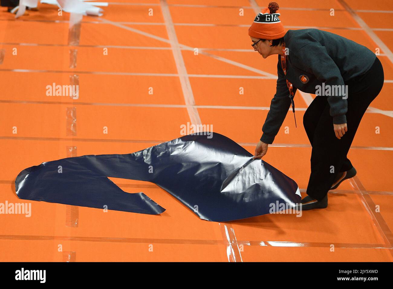 GWS Giants cheer squad member Segolene Autret prepares lettering for ...