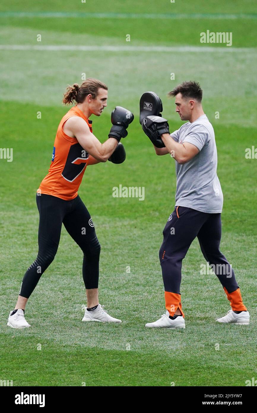 Phil Davis of the Giants boxes during a GWS Giants AFL training session ...