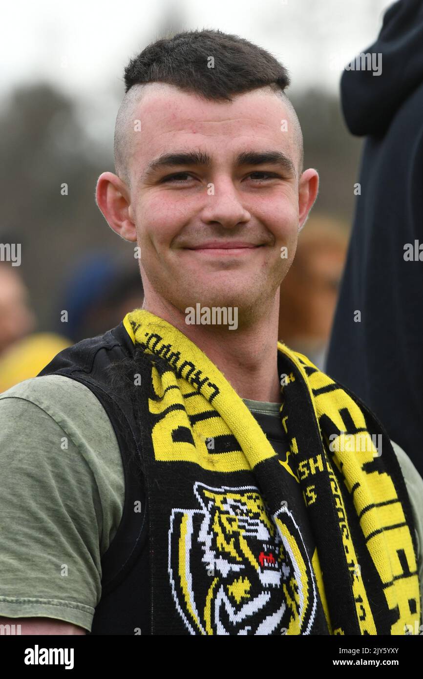 A fan is seen getting a Dustin Martin inspired haircut during the the ...