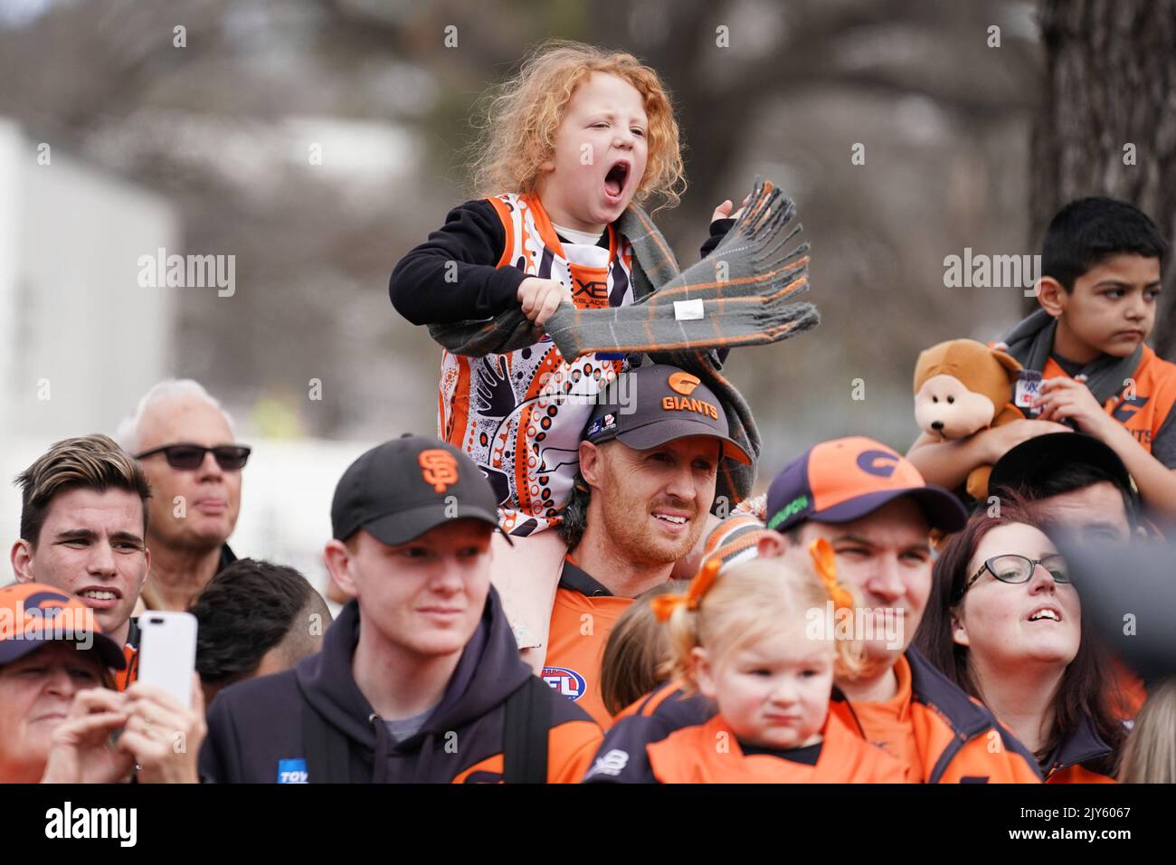 A GWS fan shows her support during the AFL Grand Final Parade in ...