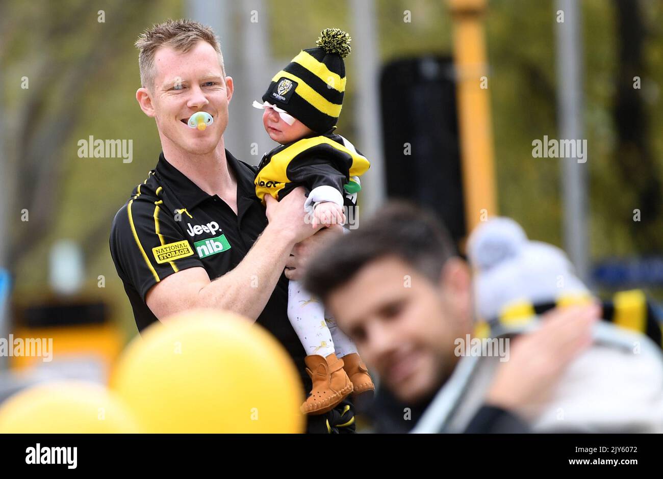 Jack Riewoldt (left) is seen with his child during the AFL Grand Final ...