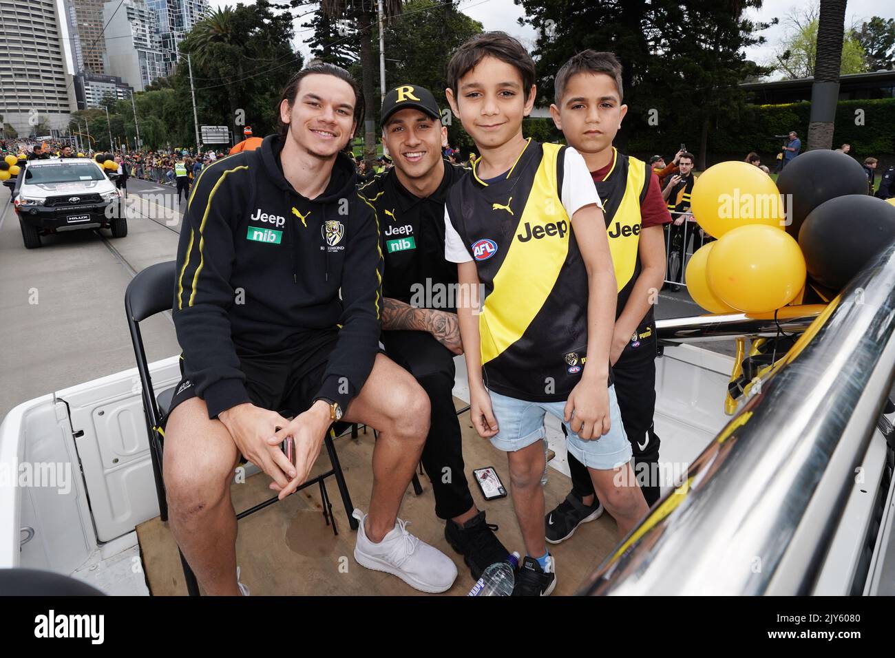 The sons of Marlion Pickett of the Tigers are seen with Daniel Rioli ...