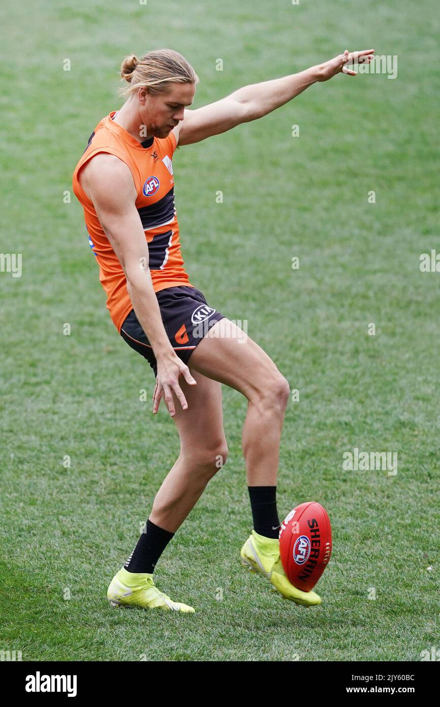 Nick Haynes of the Giants kicks the ball during a GWS Giants AFL ...