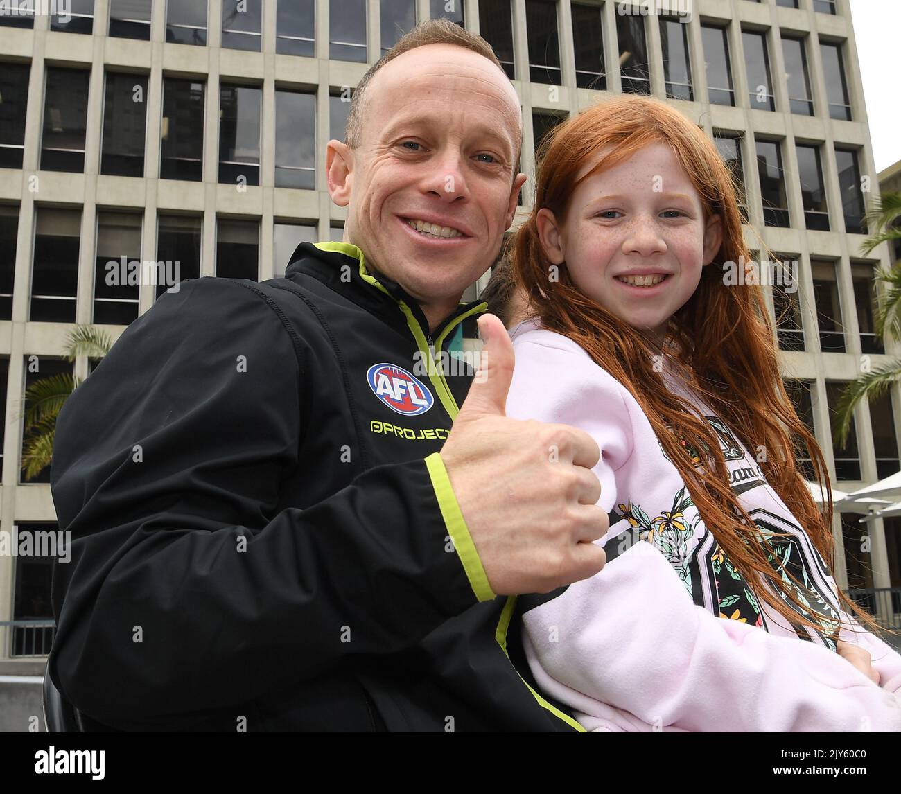 Umpire Ray Chamberlain and his daughter Scarlett as seen during the AFL ...