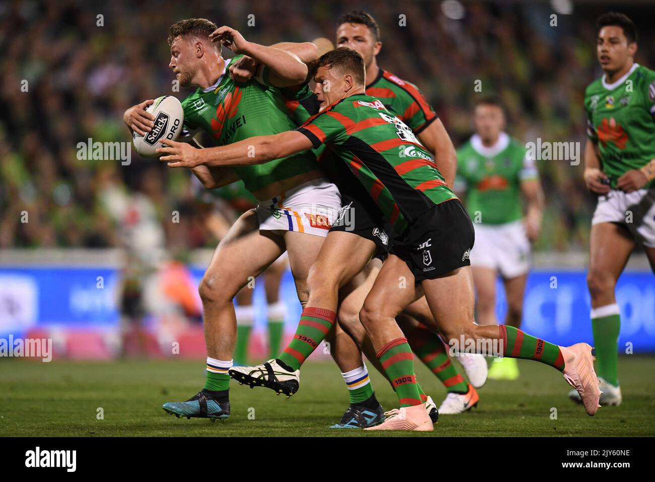 Elliott Whitehead of the Raiders is tackled by Liam Knight of the ...