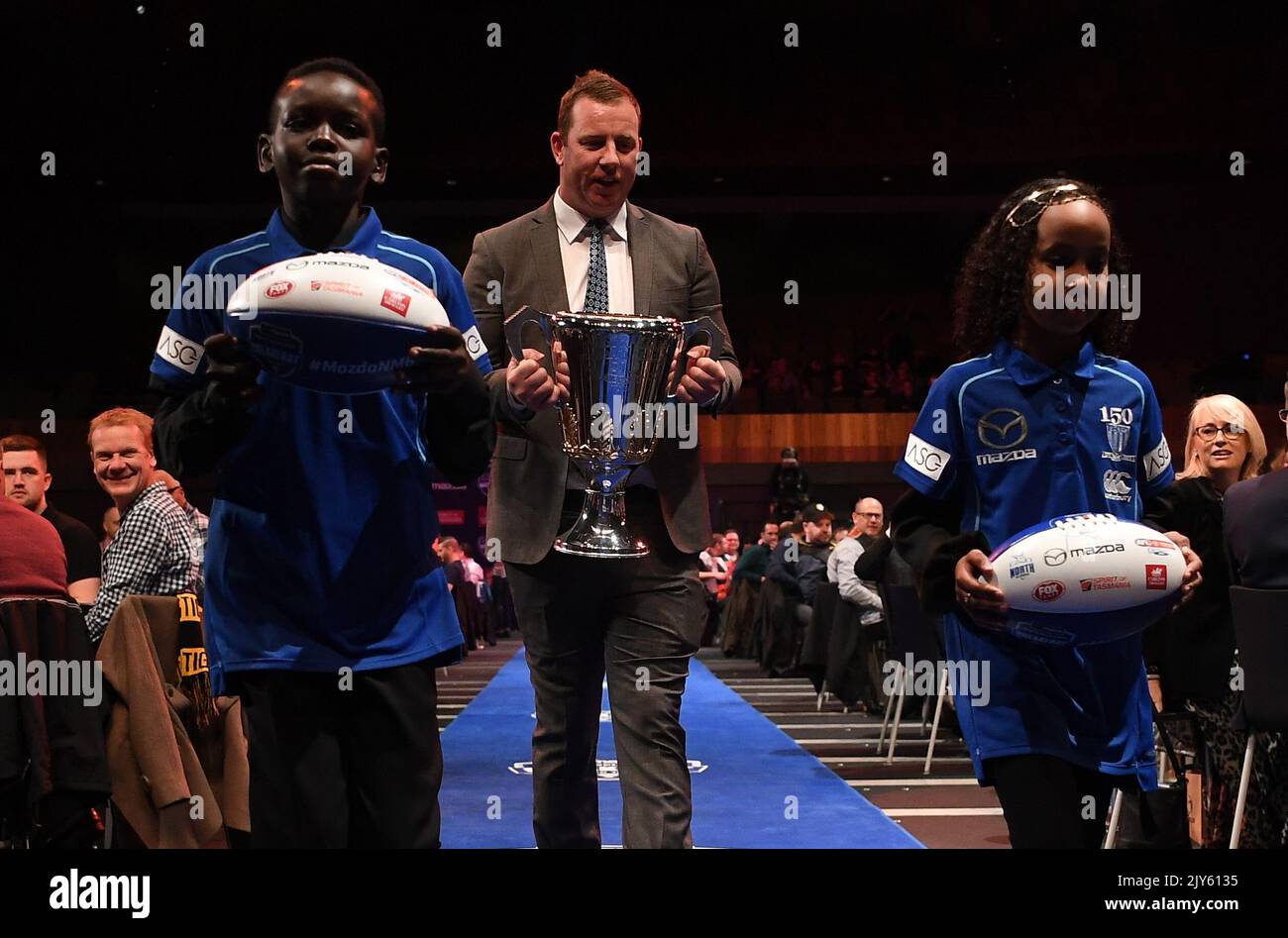 AFL Premiership Cup ambassador, Steve Johnson (centre) arrives at he ...