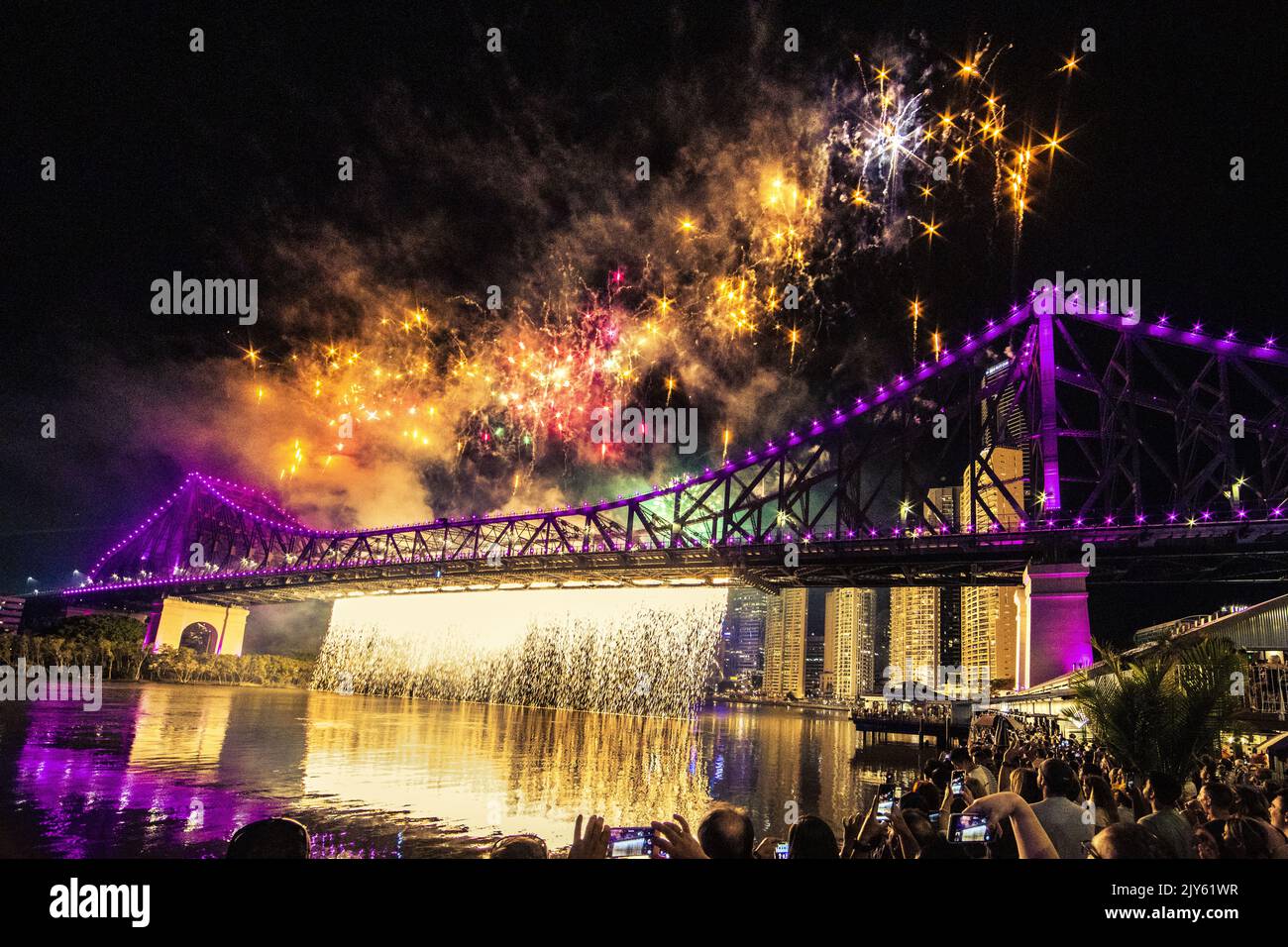 Fireworks are seen over the Story Bridge and Brisbane skyline during ...