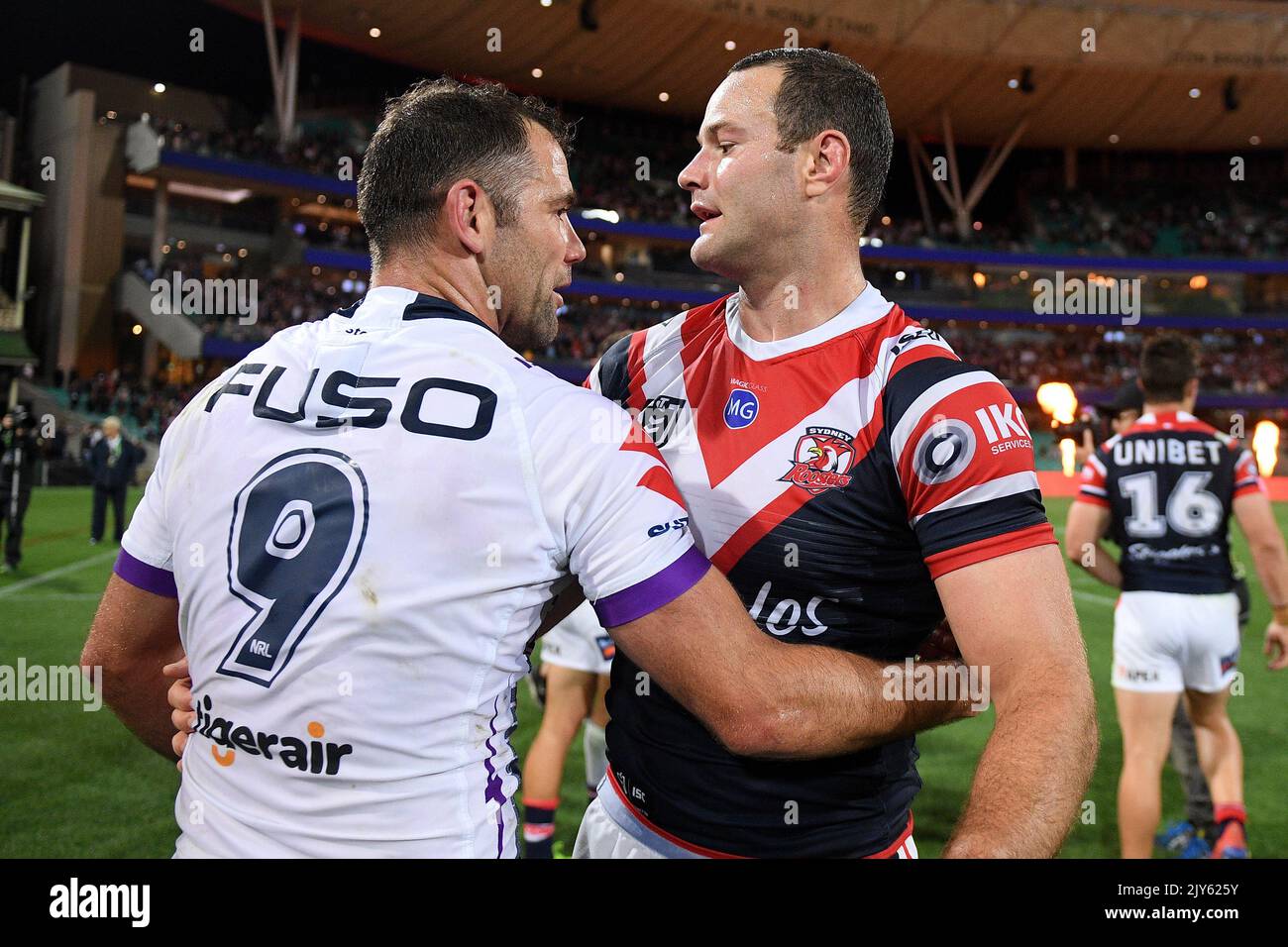 Cameron Smith of the Storm embraces Boyd Cordner of the Roosters ...