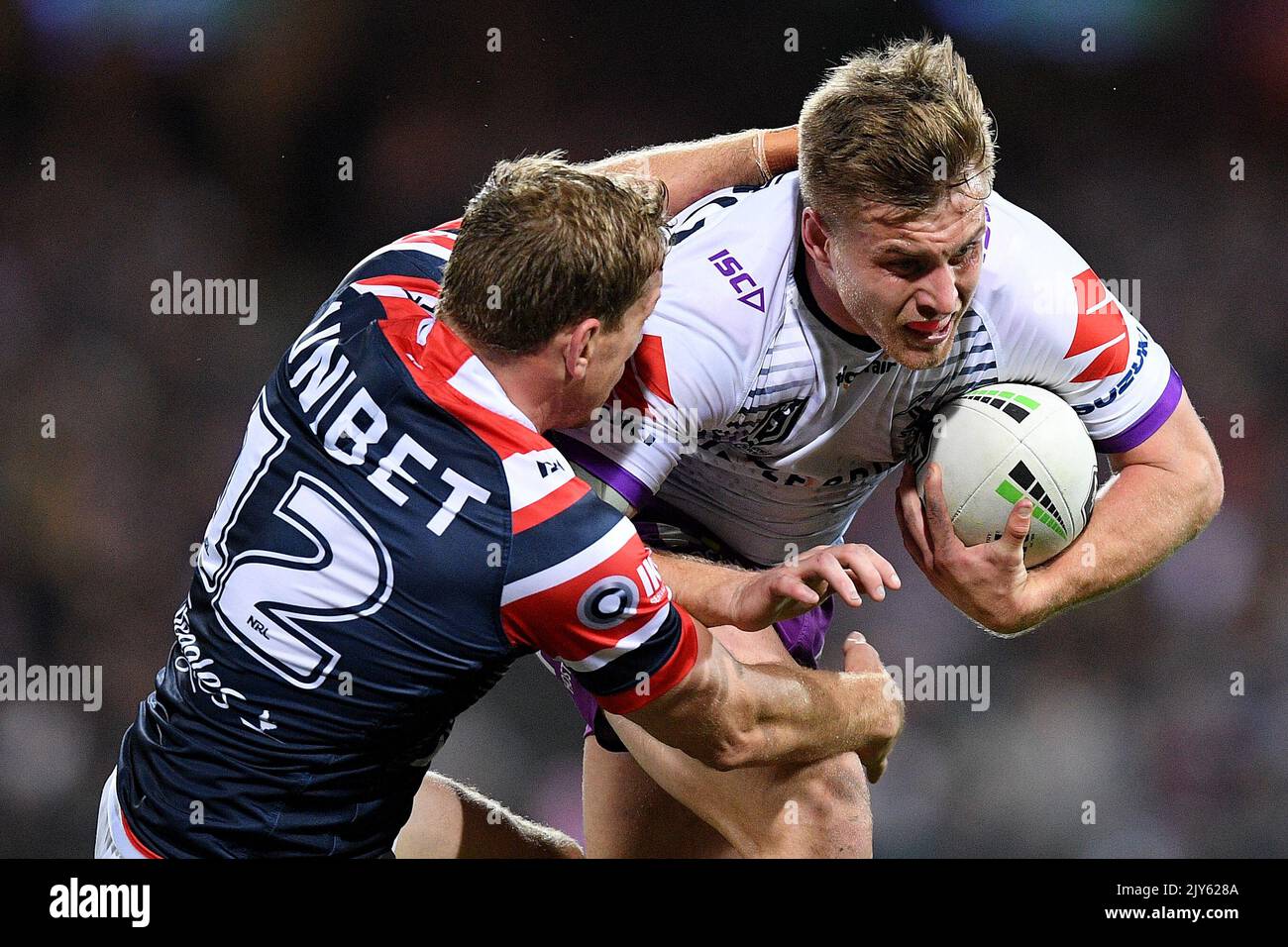 Cameron Munster of the Storm is tackled by Mitchell Aubusson of the ...