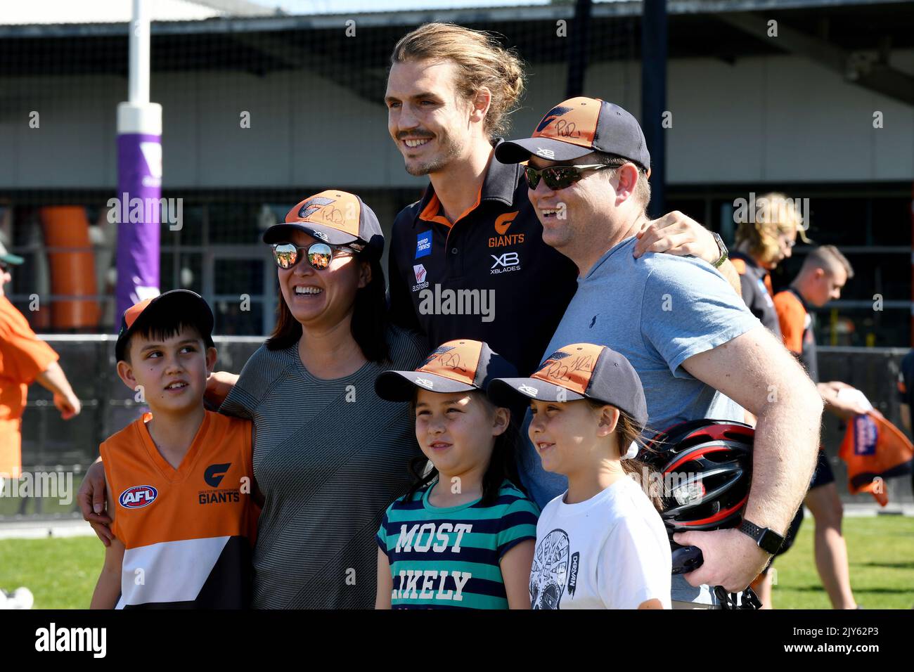 GWS Giants co-captain Phil Davis (centre) poses for a photos with fans ...