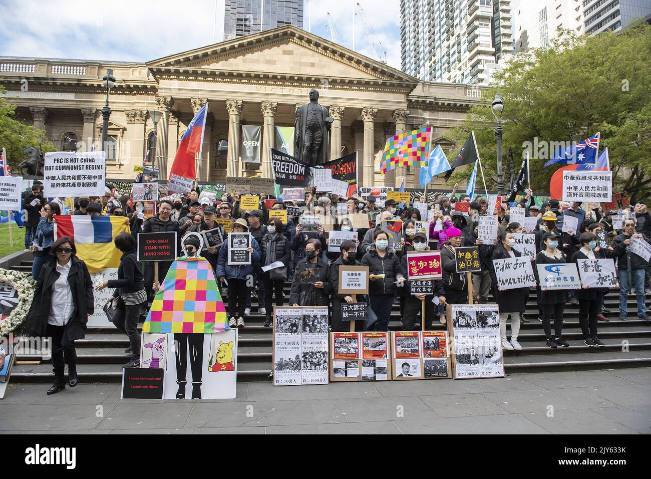 Pro-democracy supporters stand on the steps of the State Library during ...