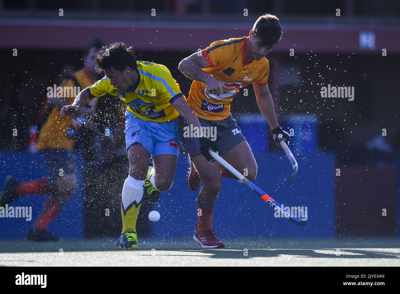 Manabu Yamashita of the Canberra Chill (left) fights for the ball with ...