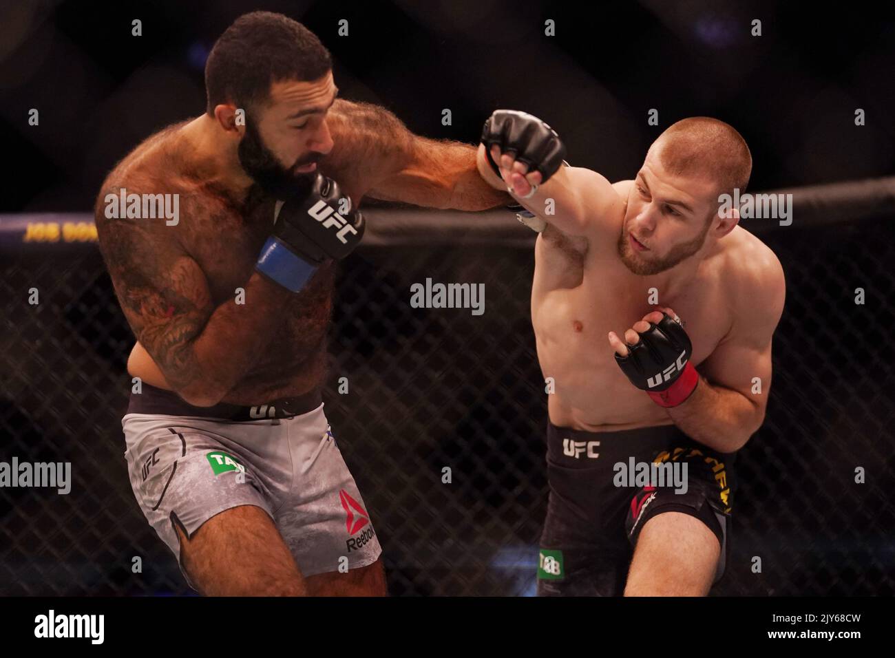 Jake Matthews and Rostem Akman compete during UFC 243 at Marvel Stadium ...