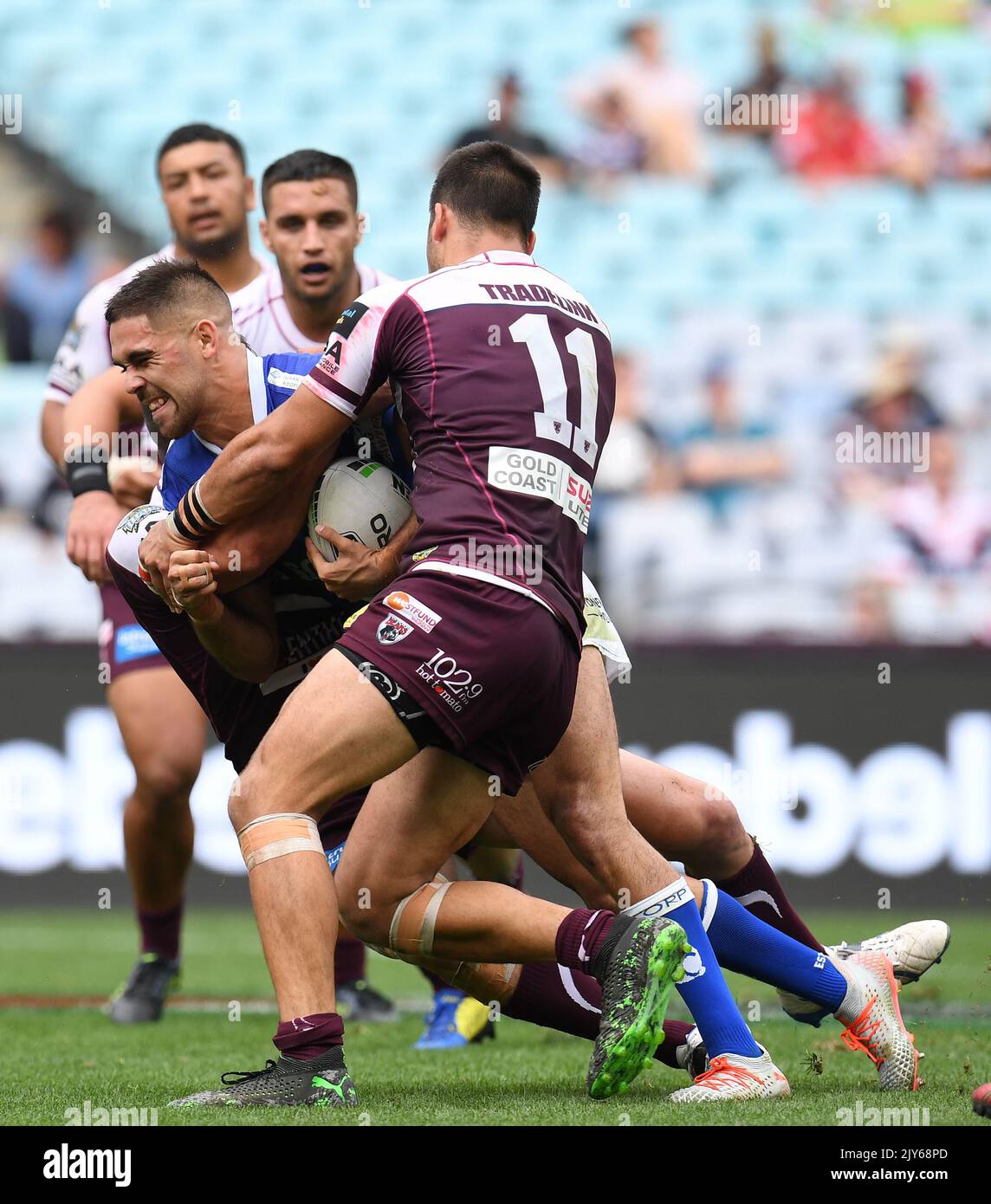William Kennedy of the Jets is tackled by Hayden Schwass of the Bears ...