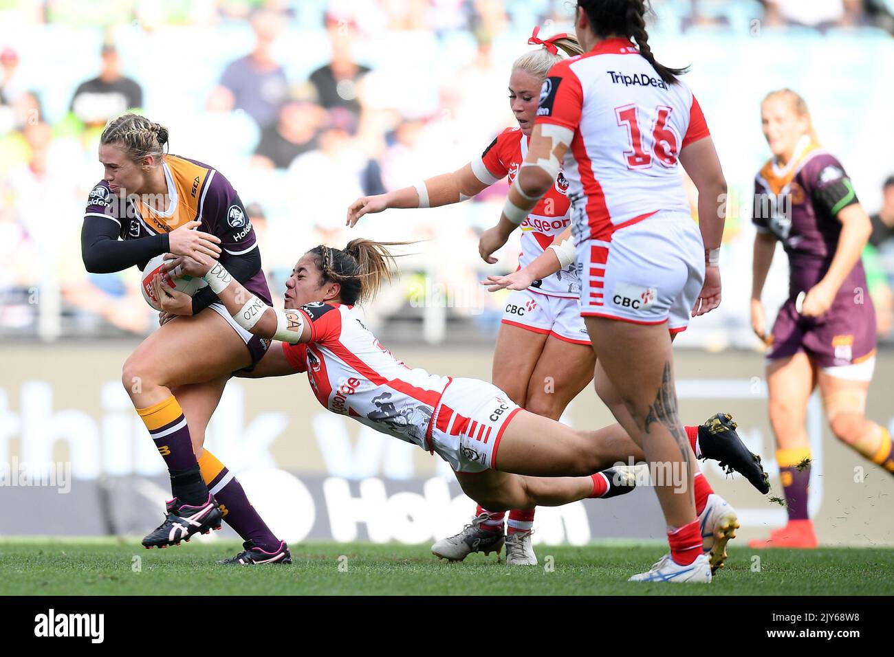 Meg Ward of the Broncos evades a tackle by Aaliyah Fasavalu-Fa'Amausili ...