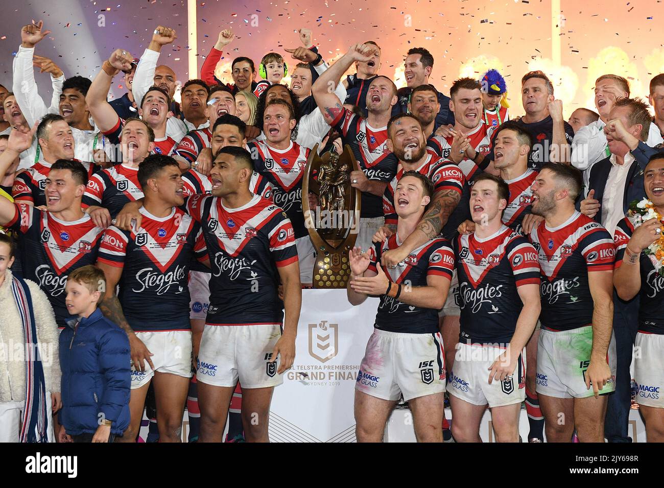 Sydney Roosters players celebrate with the Provan-Summons Trophy during ...